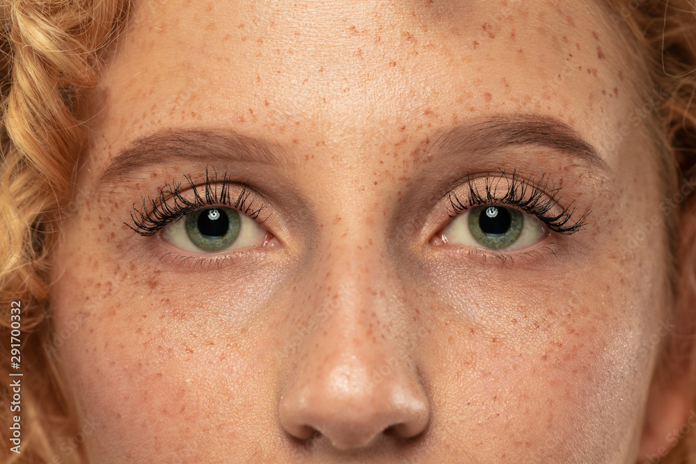 Beautiful young woman's eyes close-up shot. Female model with well-kept ...