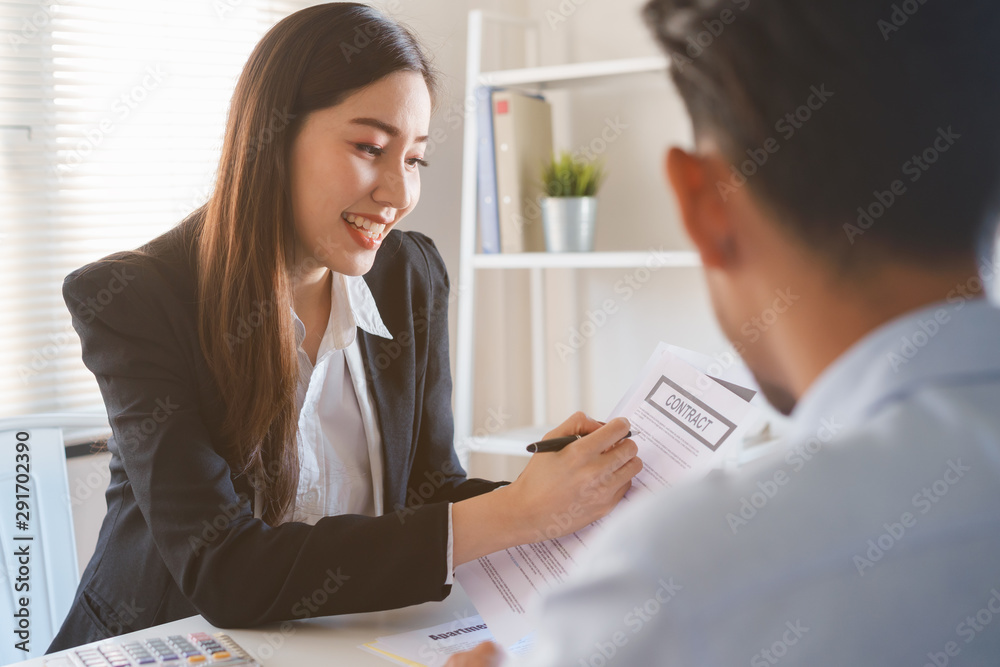 The salesman is advising and recommending the sales contract. For male ...