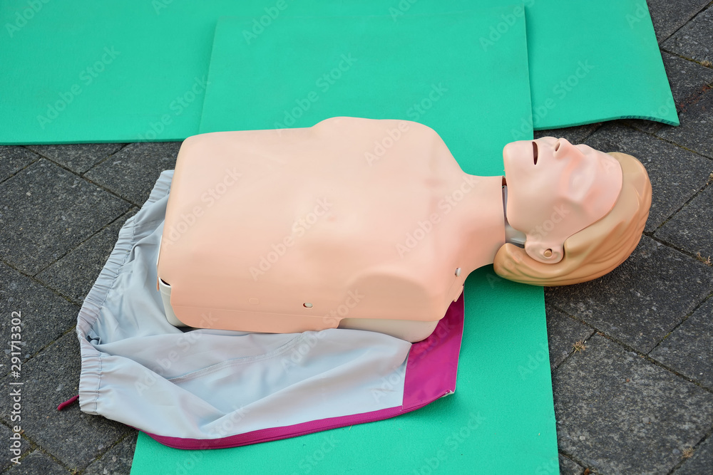 CPR first aid dummy training on the street. Plastic mannequin doll ...