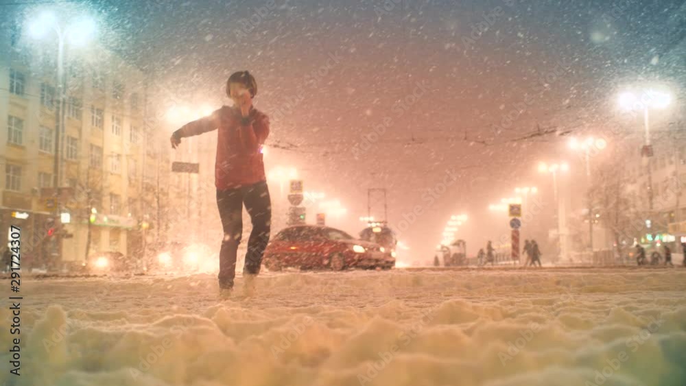 Beautiful happy young woman dancing in night city street intersection ...