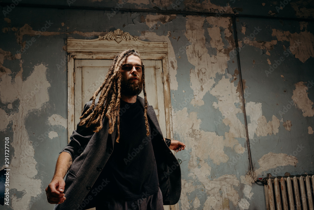 Emotion male portrait of man with dreadlocks in theater studio. Stock ...