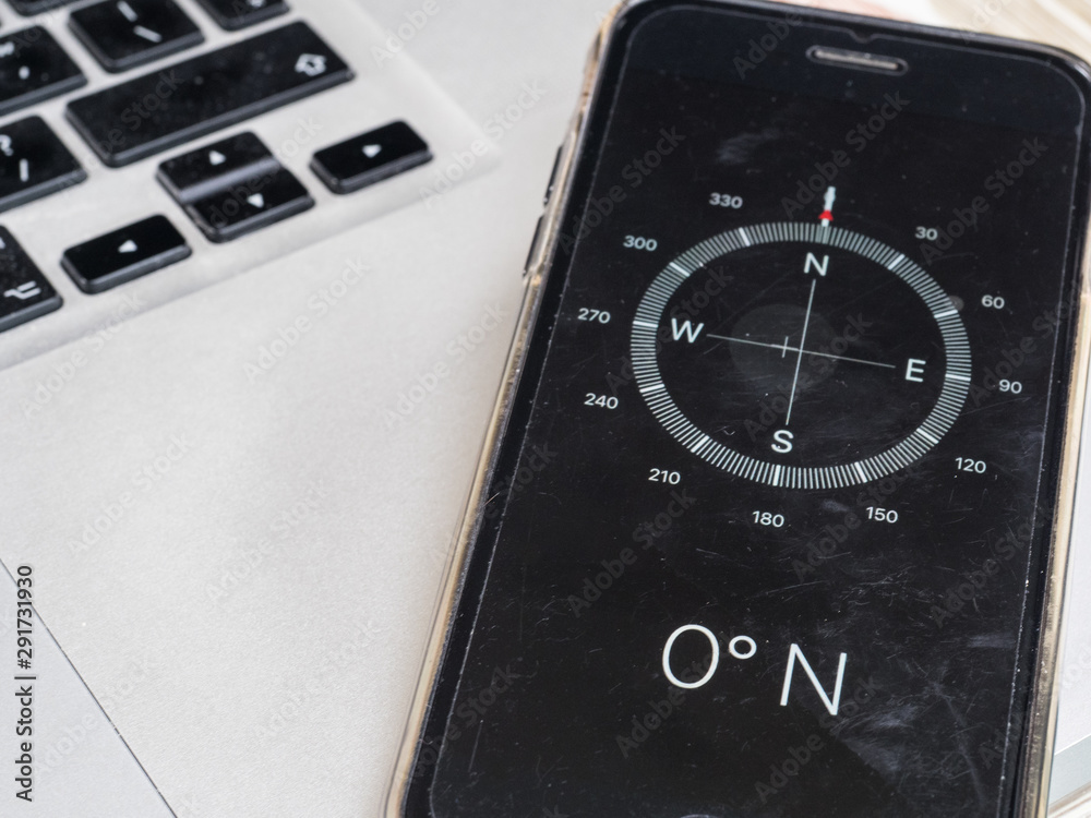 A compass on a smart phone indicates zero degrees North. Other compass ...