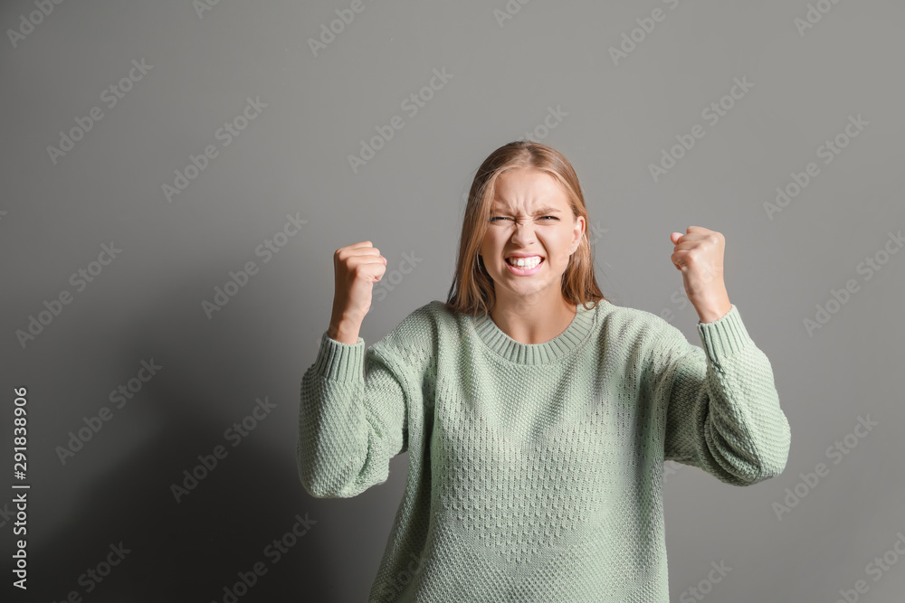 Portrait of angry woman on grey background Stock Photo | Adobe Stock