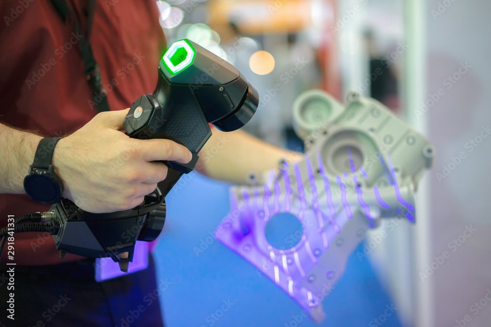 Reverse engineering concept: Engineer use 3d scanner scan work piece ...