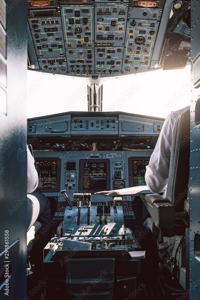 Pilot and copilot inside a cabin flying an airplane Stock Photo | Adobe ...