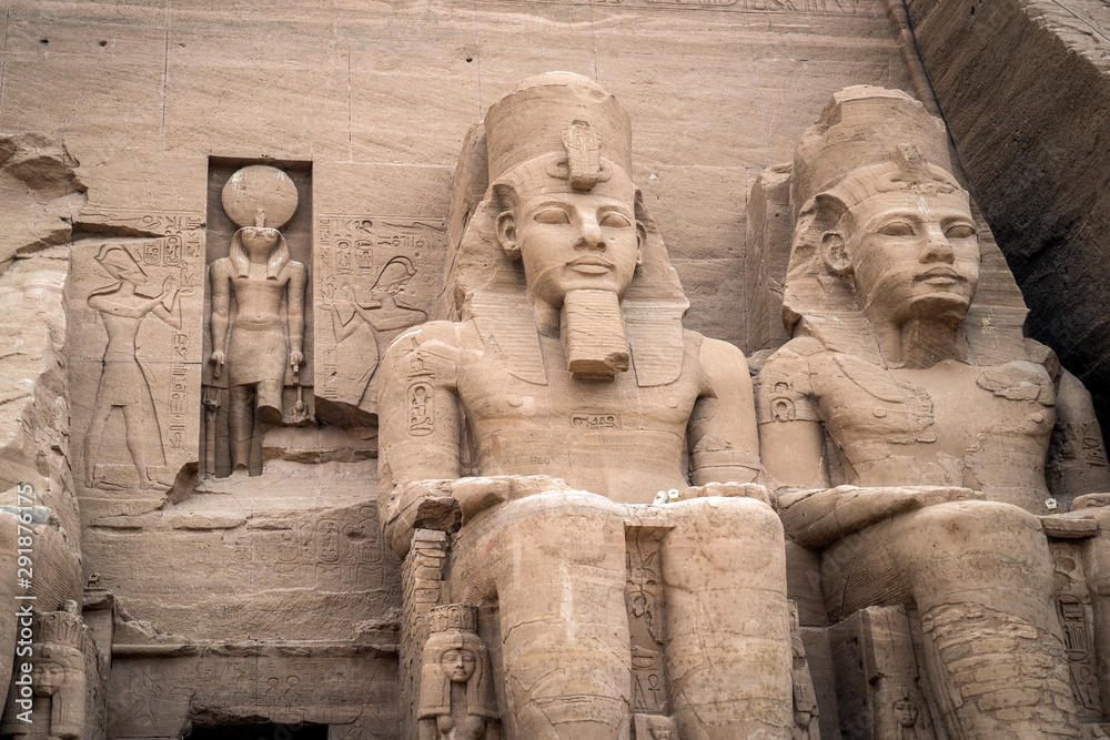 Pharaoh colossal statues at the facade of Ramses II temple, Abu Simbel ...
