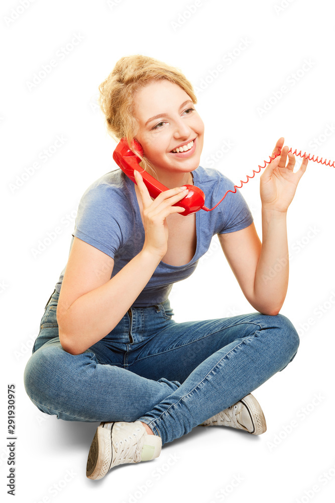 Young woman is phoning with an analog telephone Stock Photo | Adobe Stock