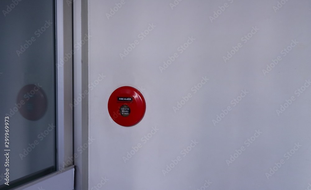 Closeup manual push station of fire alarm system, installed on the wall ...
