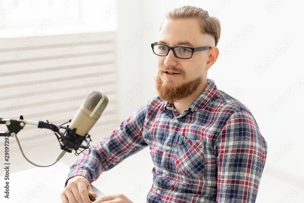 Radio host concept - Handsome man working as radio host at radio ...