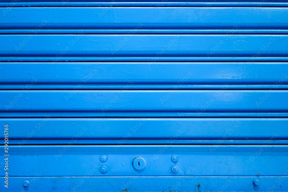 Storage shutter roller steel door with blue stripes textured background ...