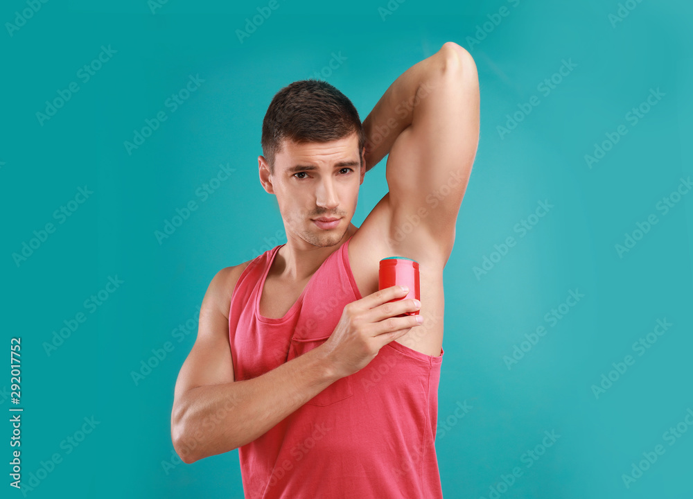 Boy Putting On Deodorant