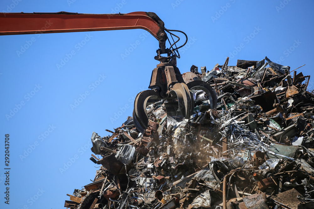 Photo & Art Print Close up industrial claw machine, move scrap metal in ...