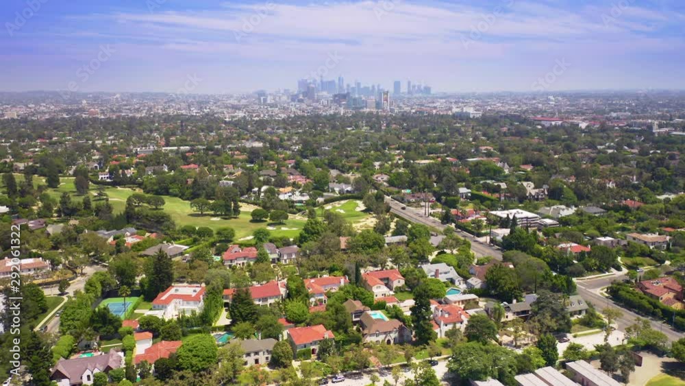Aerial 4K view of Los Angeles suburbs. Houses with red roofs, streets ...