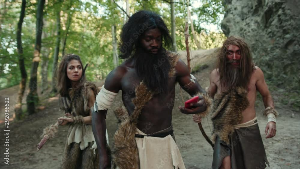 Ancient neanderthals tribe people hunting in forest looking at miracle ...