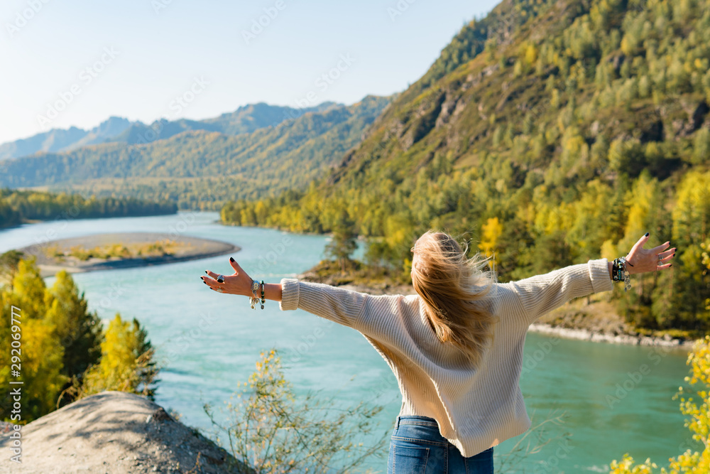 Autumn woman standing backwards and watching nature. Autumn nature ...