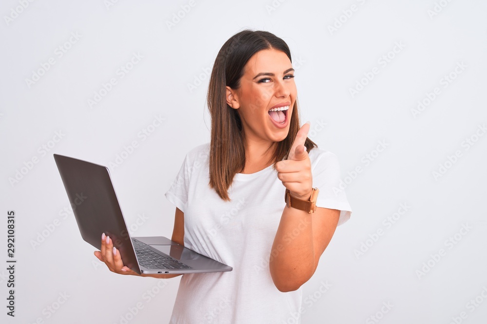 Beautiful young woman working using computer laptop over white ...