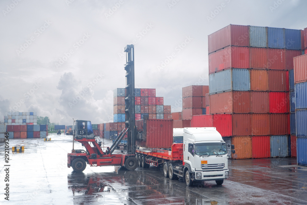 Container handlers Loading containers into trucks. Stock Photo | Adobe ...