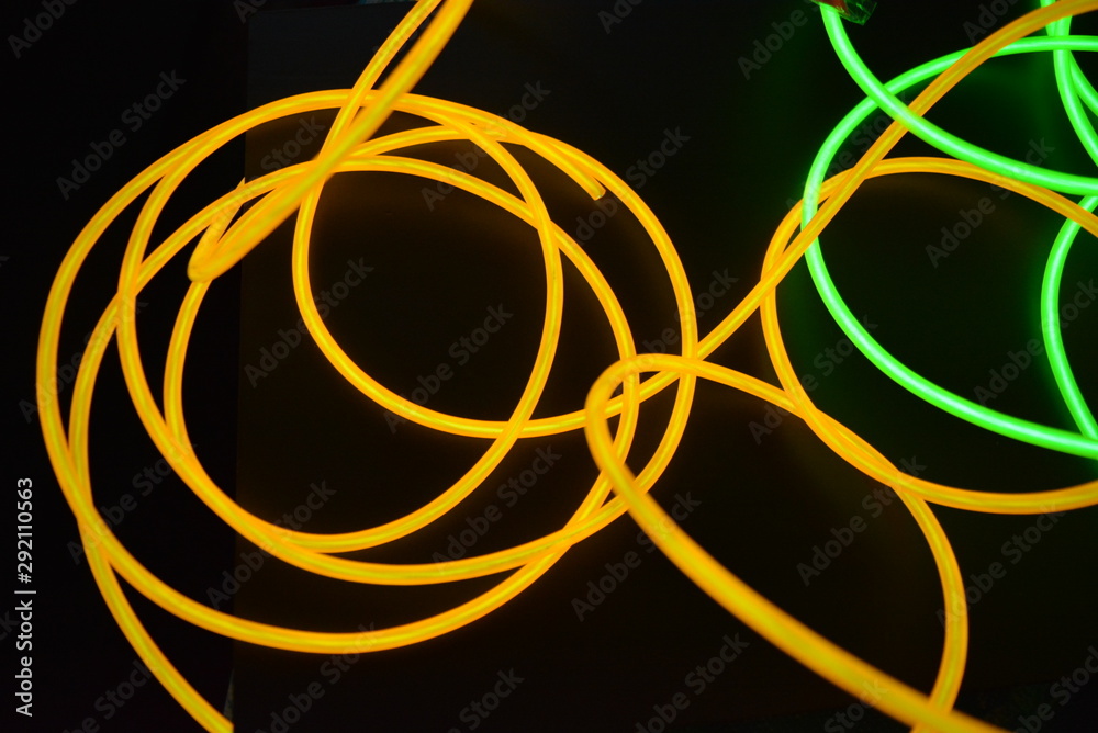 Bright luminous yellow and green, lime neon wires in different formats ...
