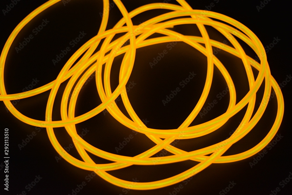 Bright orange luminous wire, twisted light wire, cable. Different ...