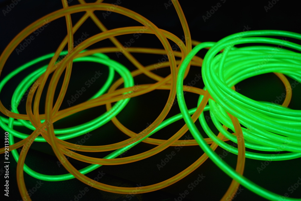 Bright luminous yellow and green, lime neon wires in different formats ...
