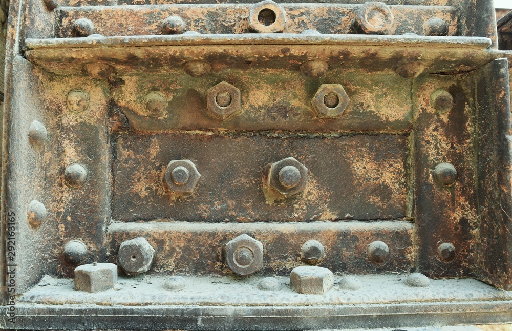 detail of a rusted and dusted steel old structure with rivets and bolts ...