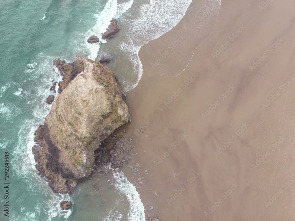 Beach landscape top view, sand, road and rock in the water. Sand, ocean ...