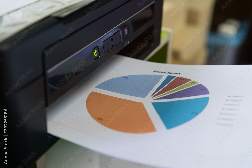 Printer printing document graph diagrams for report finacial business ...