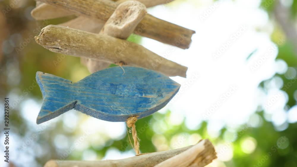 Wooden fish with park on background. Signboard of seafood tavern, cafe ...