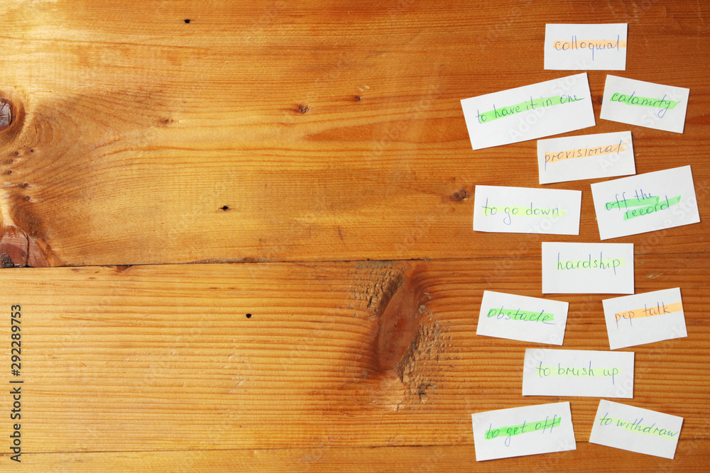 Different English words written in notes for remembering exercise ...