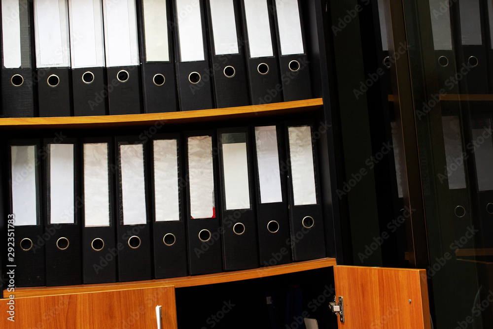 Office folders are well placed and organized in a filing cabinet with a ...
