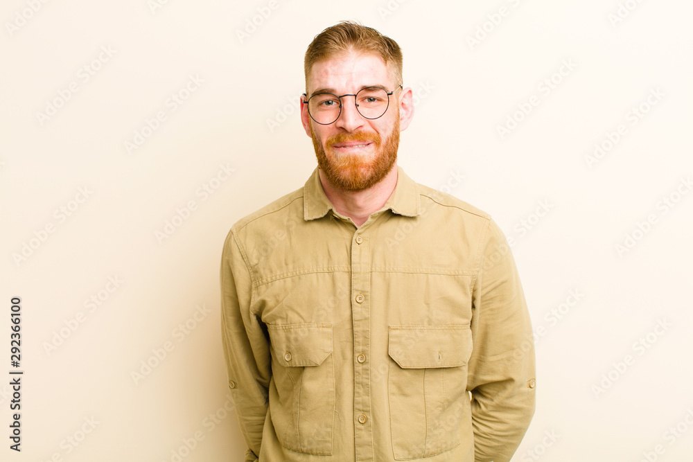 young red head man looking happy and goofy with a broad, fun, loony ...