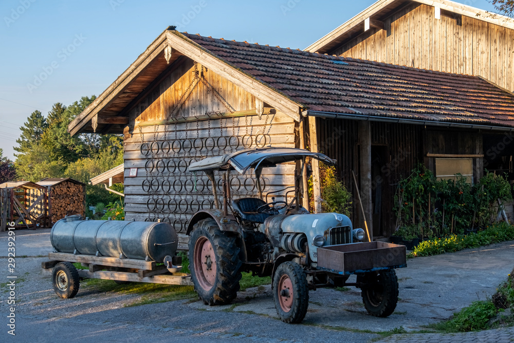 Alter Trecker mit Guellefass als Viehstraenke Stock Photo | Adobe Stock