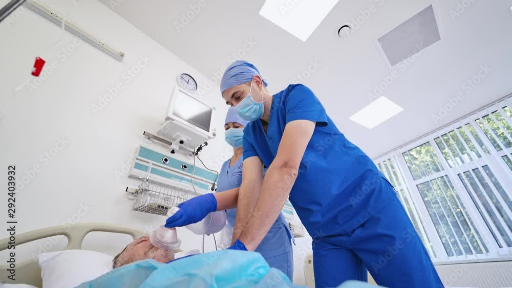 Doctor trying to save dying patient in the emergency room background ...