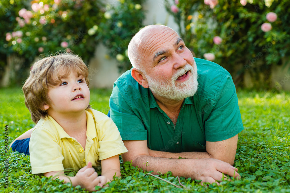 Happy family Grandson hugs his grandpa on holiday. Two generation ...
