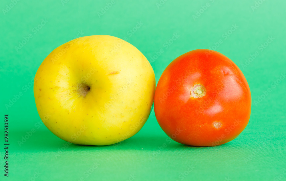 fruits and vegetables/an apple and a tomato Stock Photo | Adobe Stock