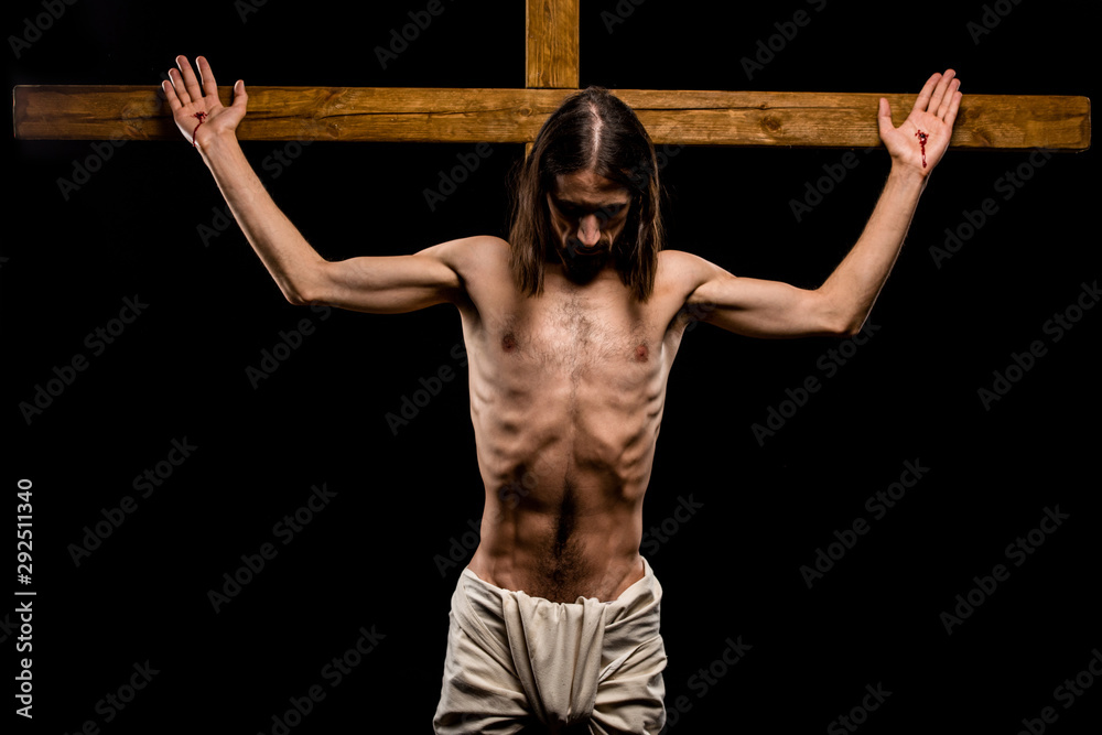 shirtless man crucified on cross isolated on black Stock Photo | Adobe ...