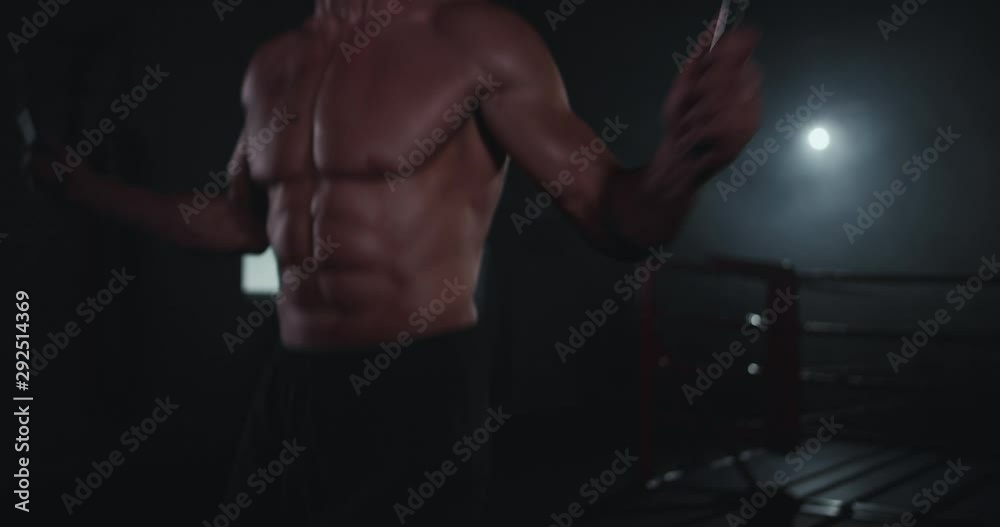 Details closeup of a perfect abs and biceps full of muscle guy jumping ...