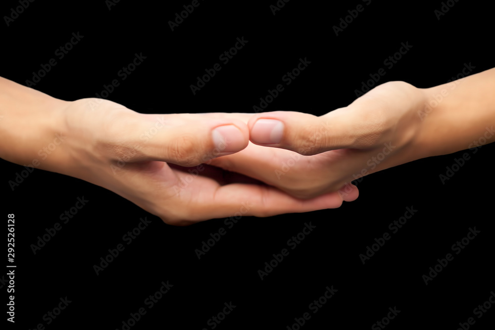 Close up shot of pair of human hands with open hands stacked hands-on ...