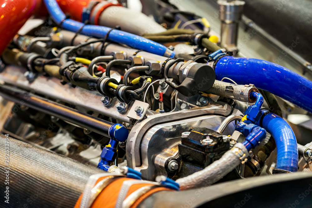 Modern car engine closeup. Fragment of the vehicle with wiring of tubes ...