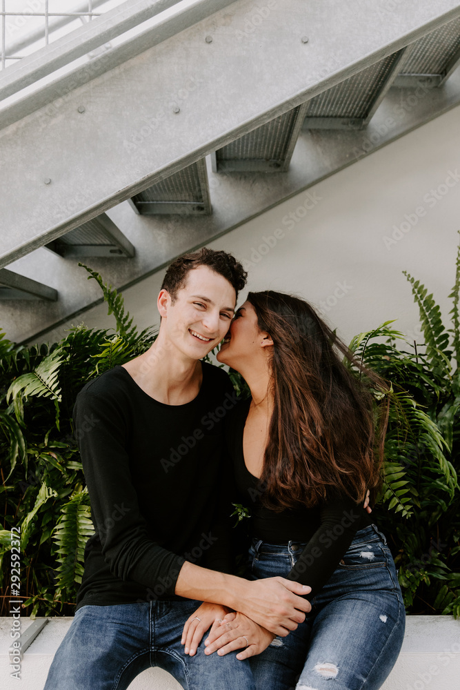 Cute Young Couple in Love Sitting in Front of Urban Concrete Stairs and ...
