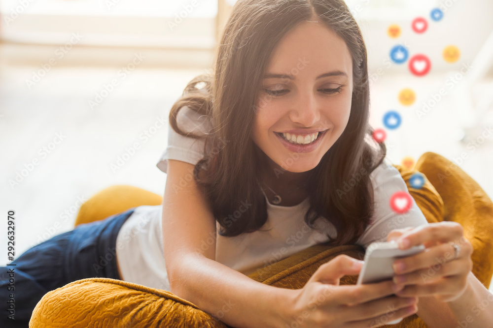 A beautiful young woman blogger, vlogger or influencer is receiving ...