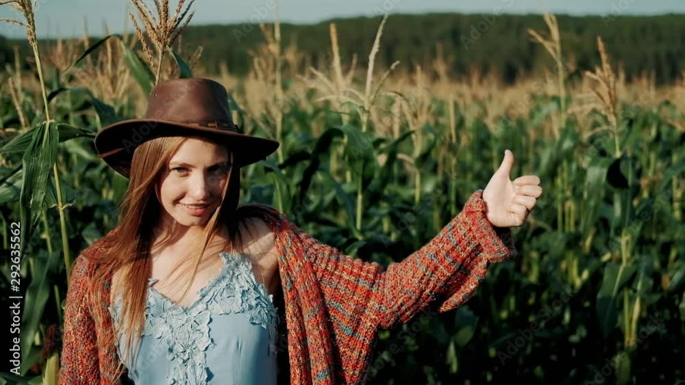 Portrait of Young Farmer girl in Hat Shows Up with Hand Her Corn Field ...