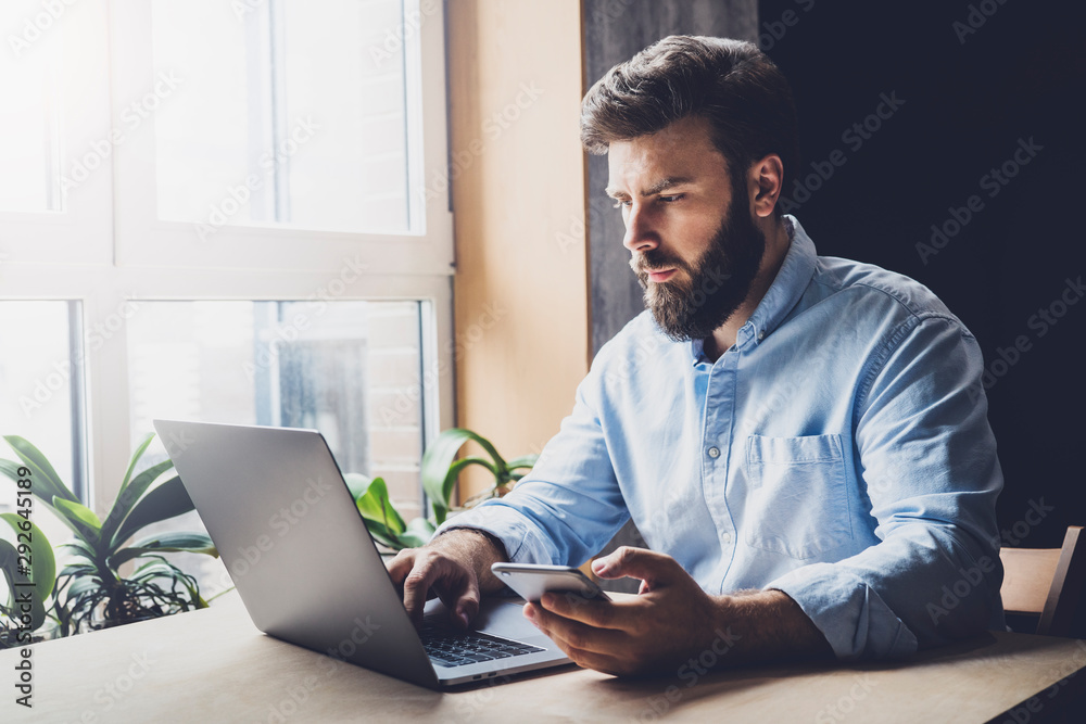 Creative worker using digital devices and programs in project ...