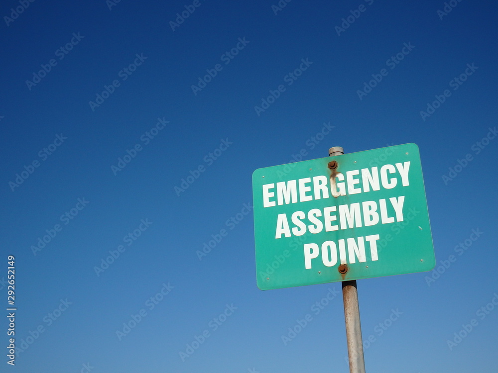 Enamel sign of emergency assembly point in green Stock Photo | Adobe Stock