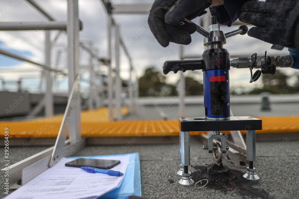 Engineer conducting using pull machinery testing chemical set fall ...