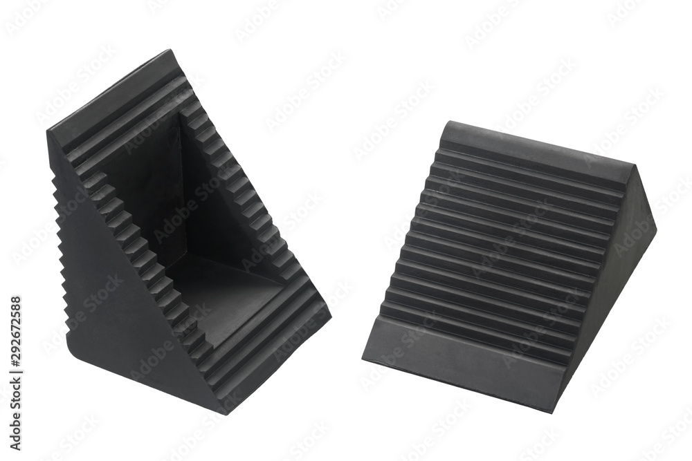 Rubber wheel chocks isolated on a white background. They are used for ...