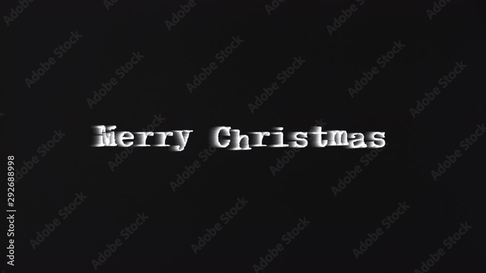 A scary text, Merry Christmas, appearing on the screen with a light ...