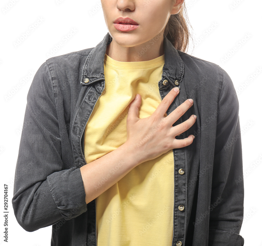 Young woman suffering from heart attack on white background Stock Photo ...