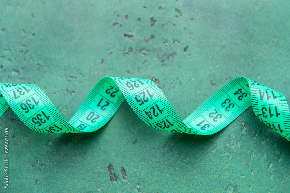 Measuring tape on color background Stock Photo | Adobe Stock