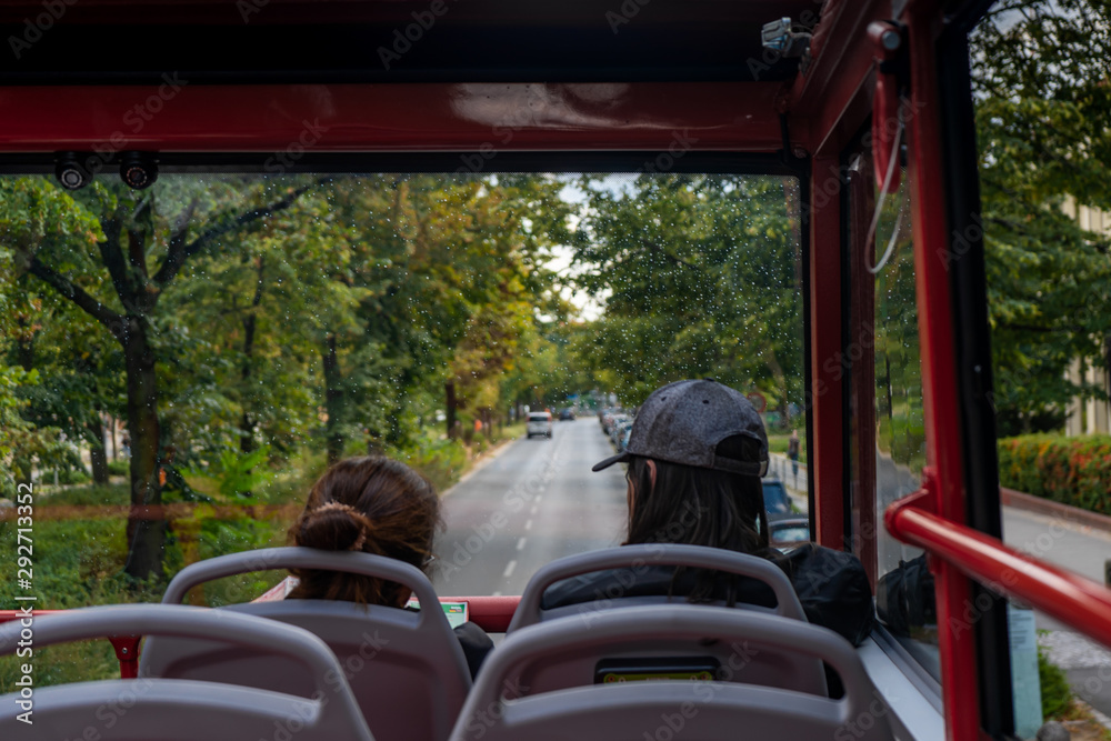 Ride the double Decker bus on the second floor on a rainy day. Ahead is ...